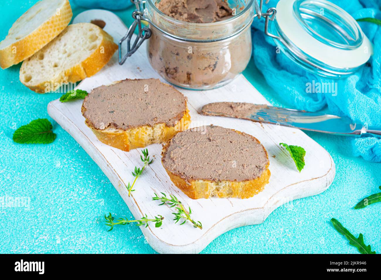 Sandwich with chicken liver pate on blue background Stock Photo - Alamy