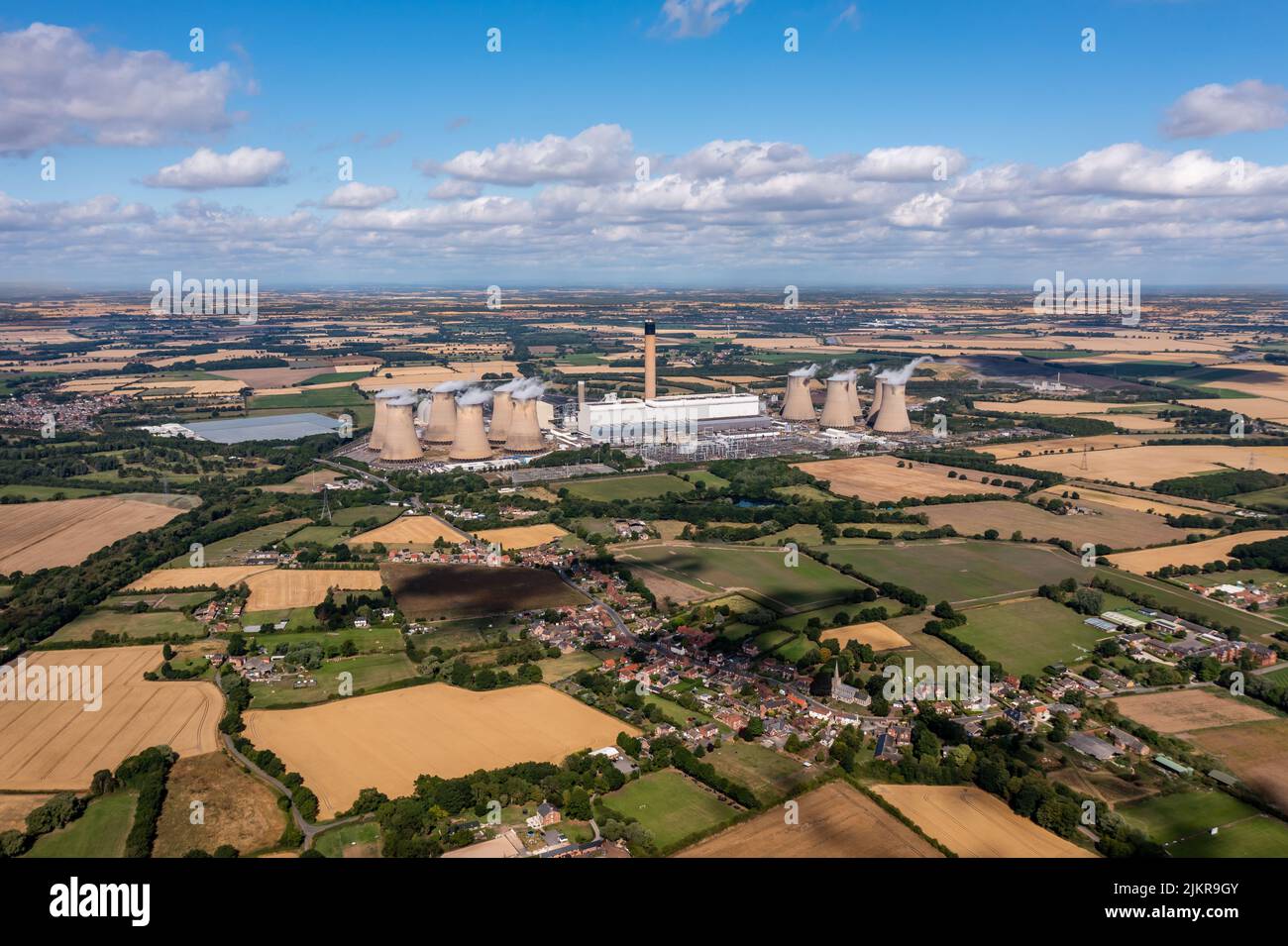 Aerial landscape view of Drax Power Station in North Yorkshire with smoking chimneys and cooling ...