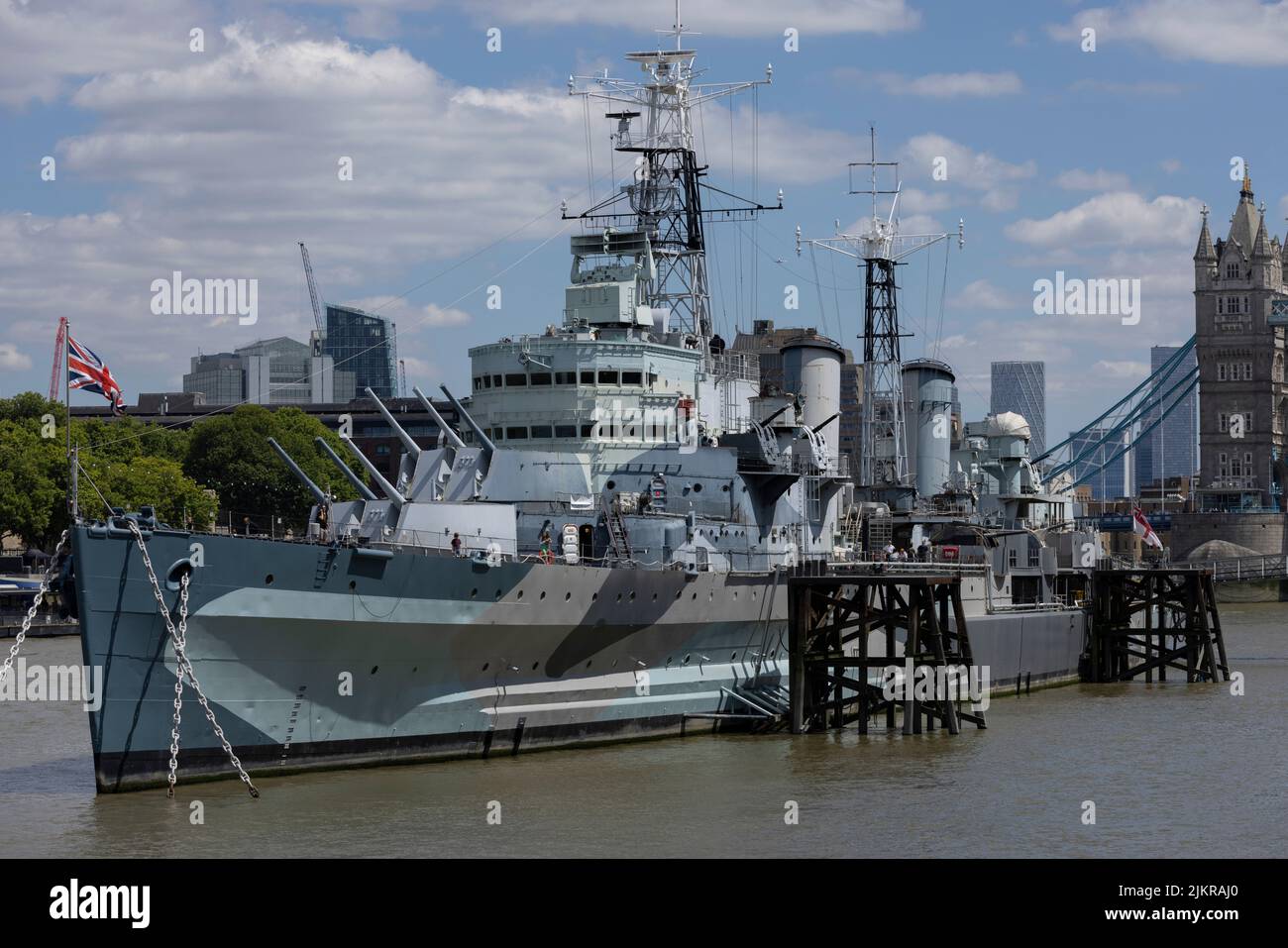 HMS Belfast, with the City of London skyscrapers and Tower Bridge in ...