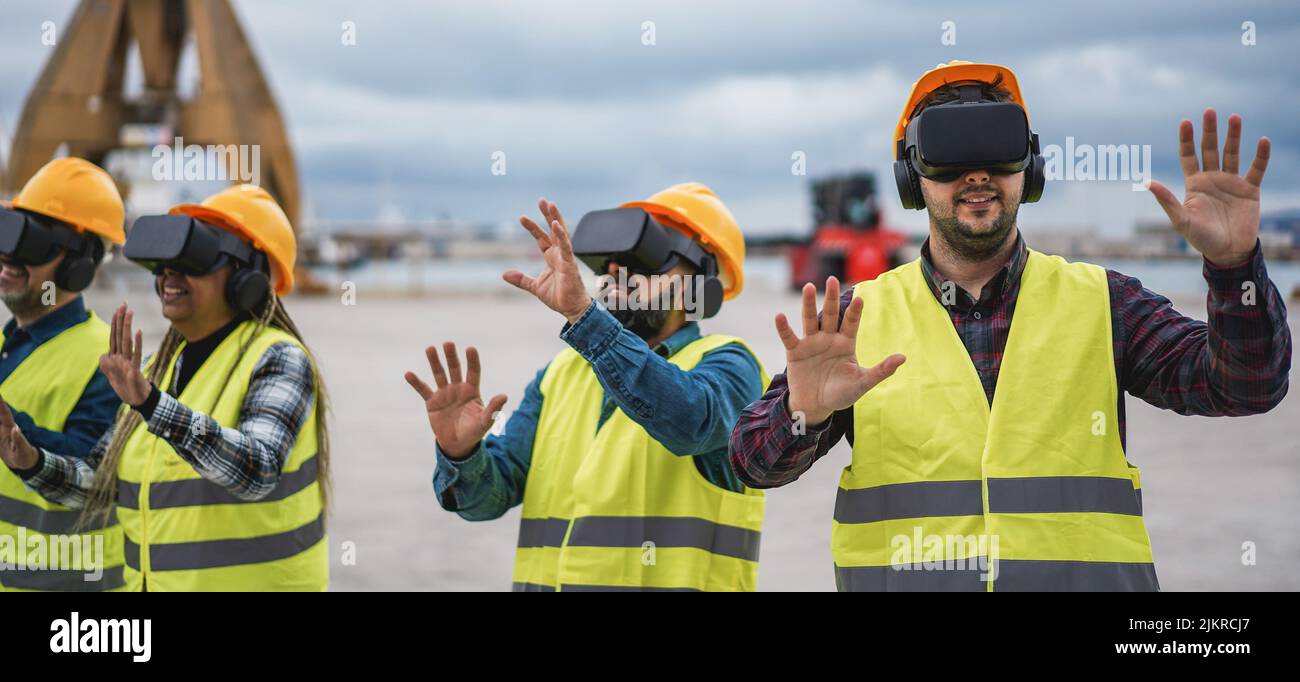 Multiracial workers using virtual reality headsets at Freight Terminal ...