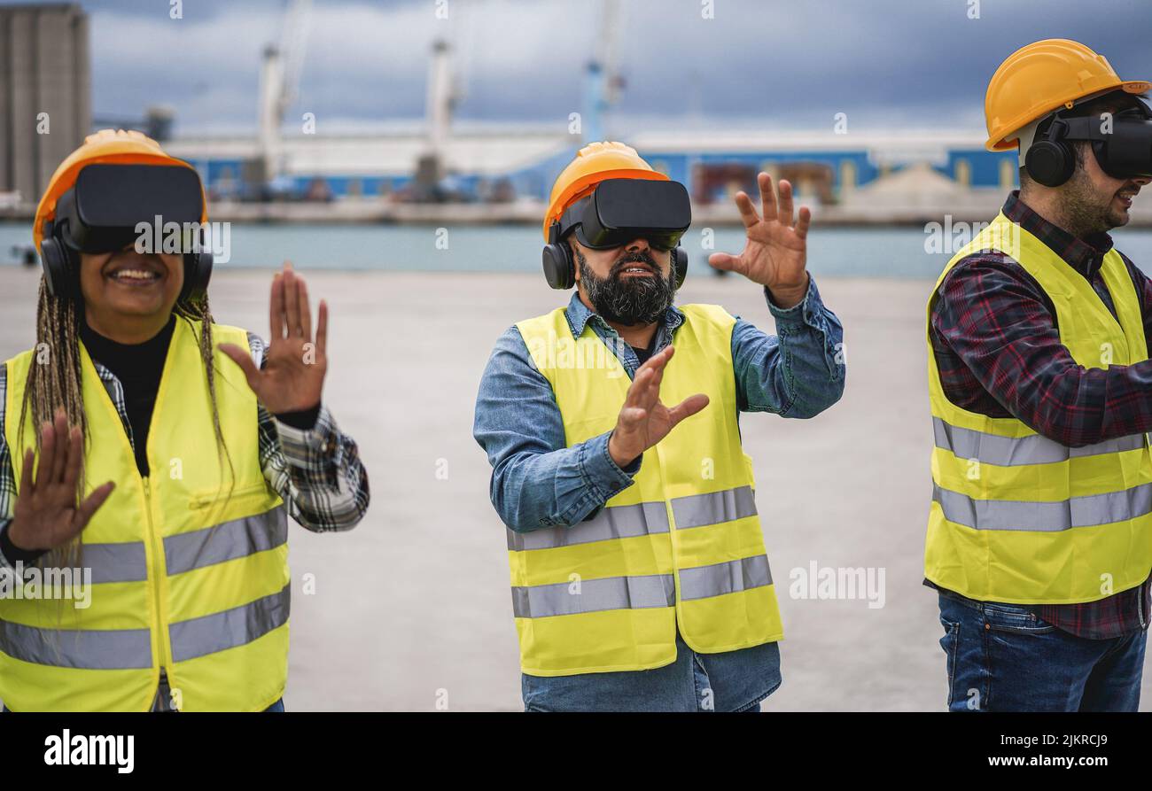 Multiracial workers using virtual reality headsets at Freight Terminal ...