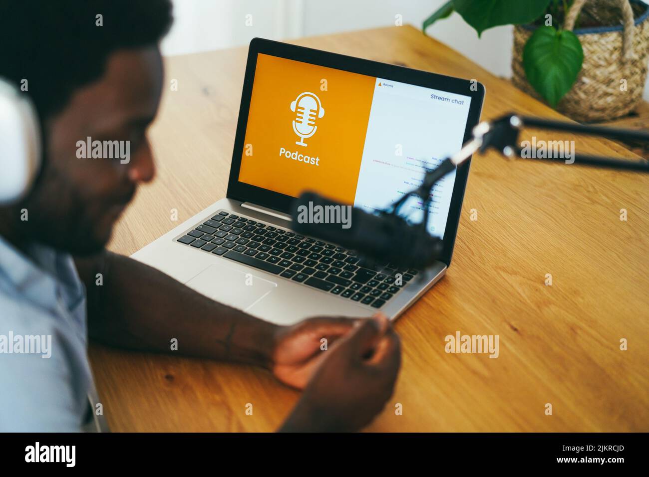 African man live streaming podcast session at home studio - Focus on ...