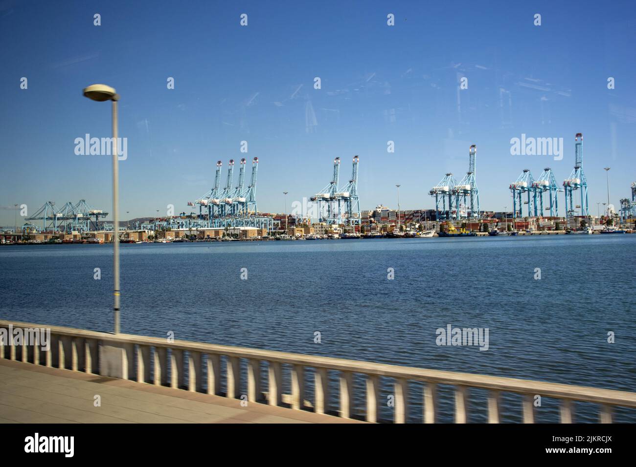 ALGECIRAS, ANDALUSIA, SPAIN - NOVEMBER 5, 2021 line of loading cranes ...