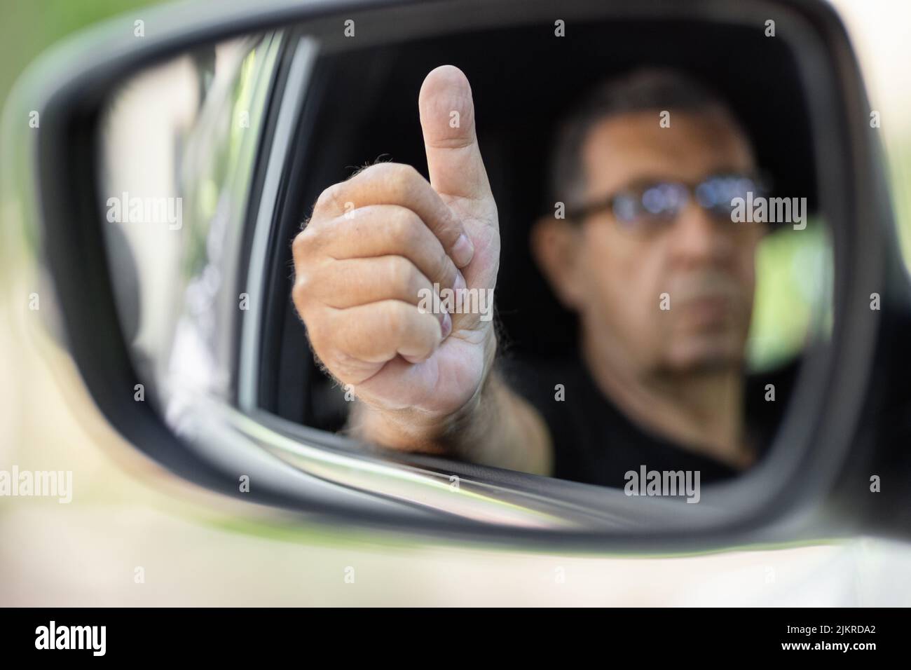 Happy senior in his 70s driving a car Stock Photo - Alamy