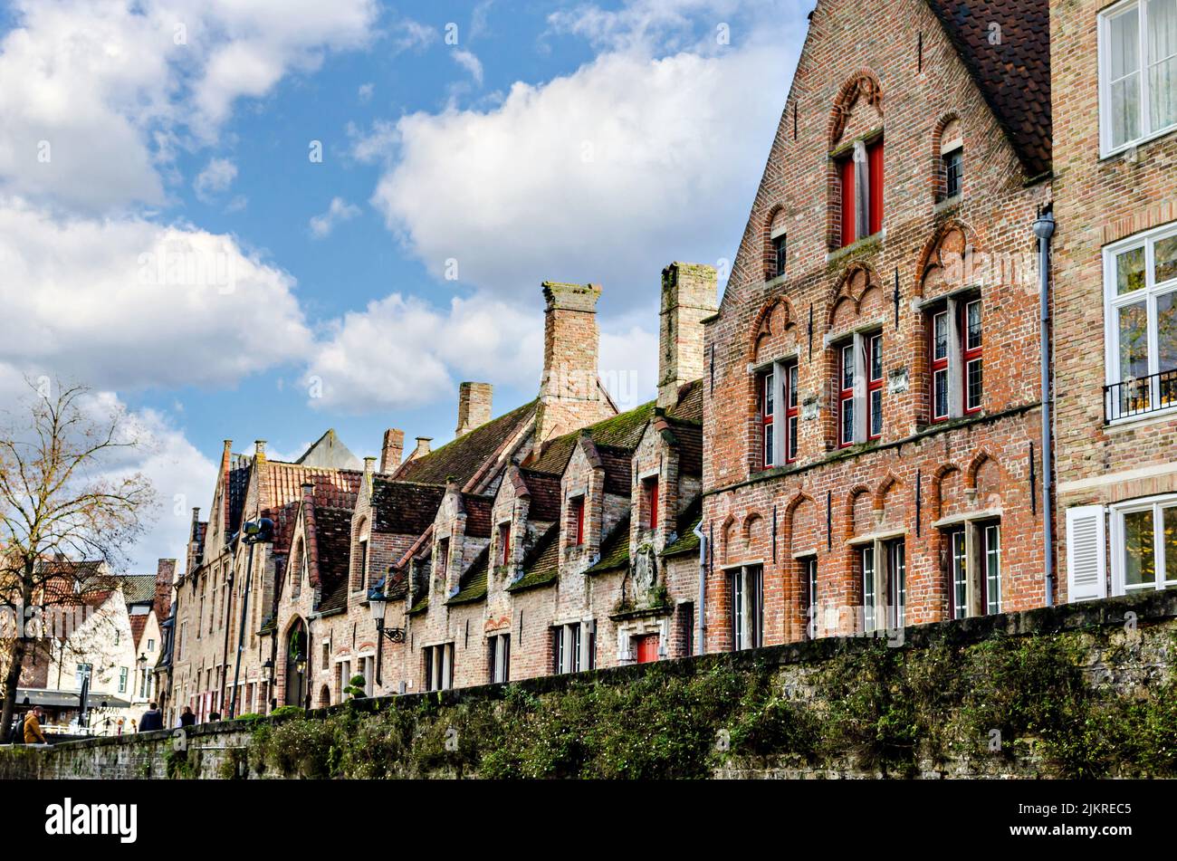 Bruges, Belgium; view of the medieval buildings that are crossed by the ...