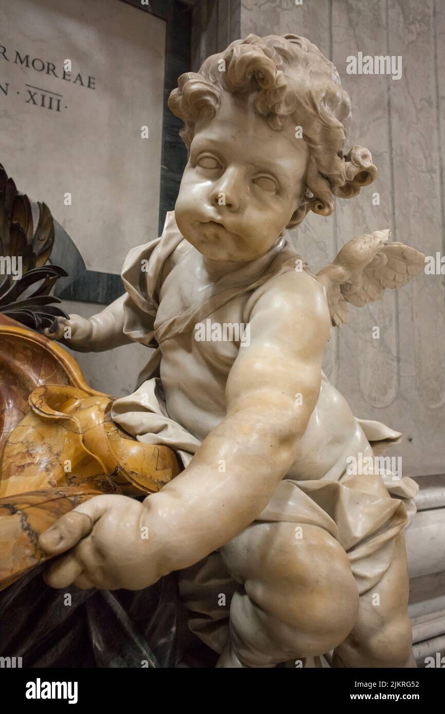 The cherub sculpture of the Bernini’s holy water font in St. Peter’s ...