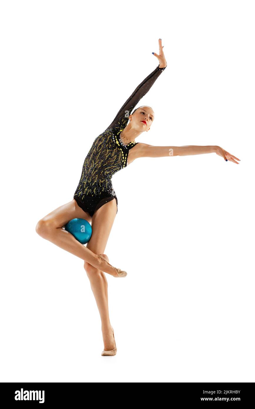 Portrait of young tender girl, rhythmic gymnast athlete doing exercises ...
