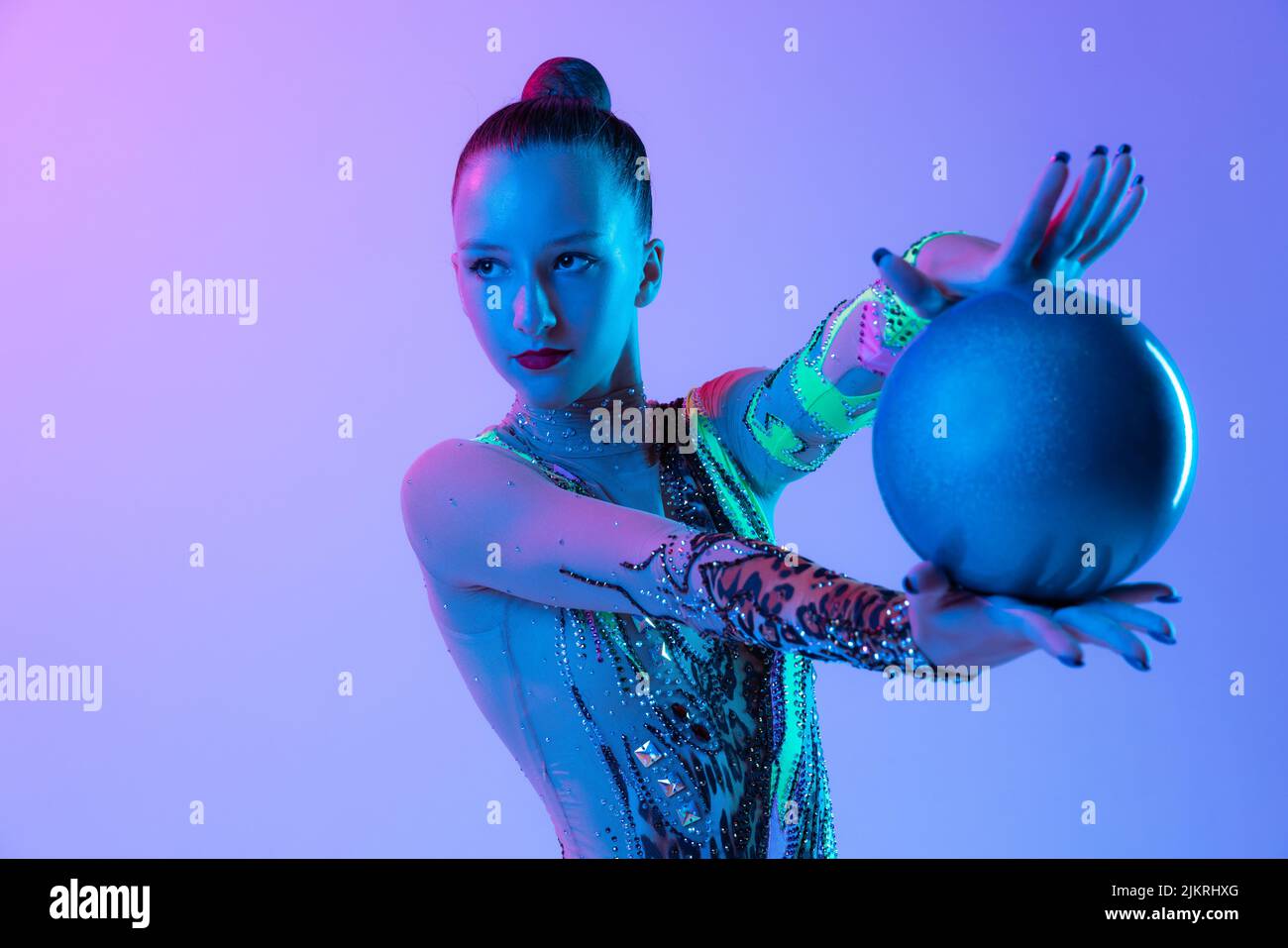 Portrait of young beautiful girl, rhythmic gymnast athlete training ...