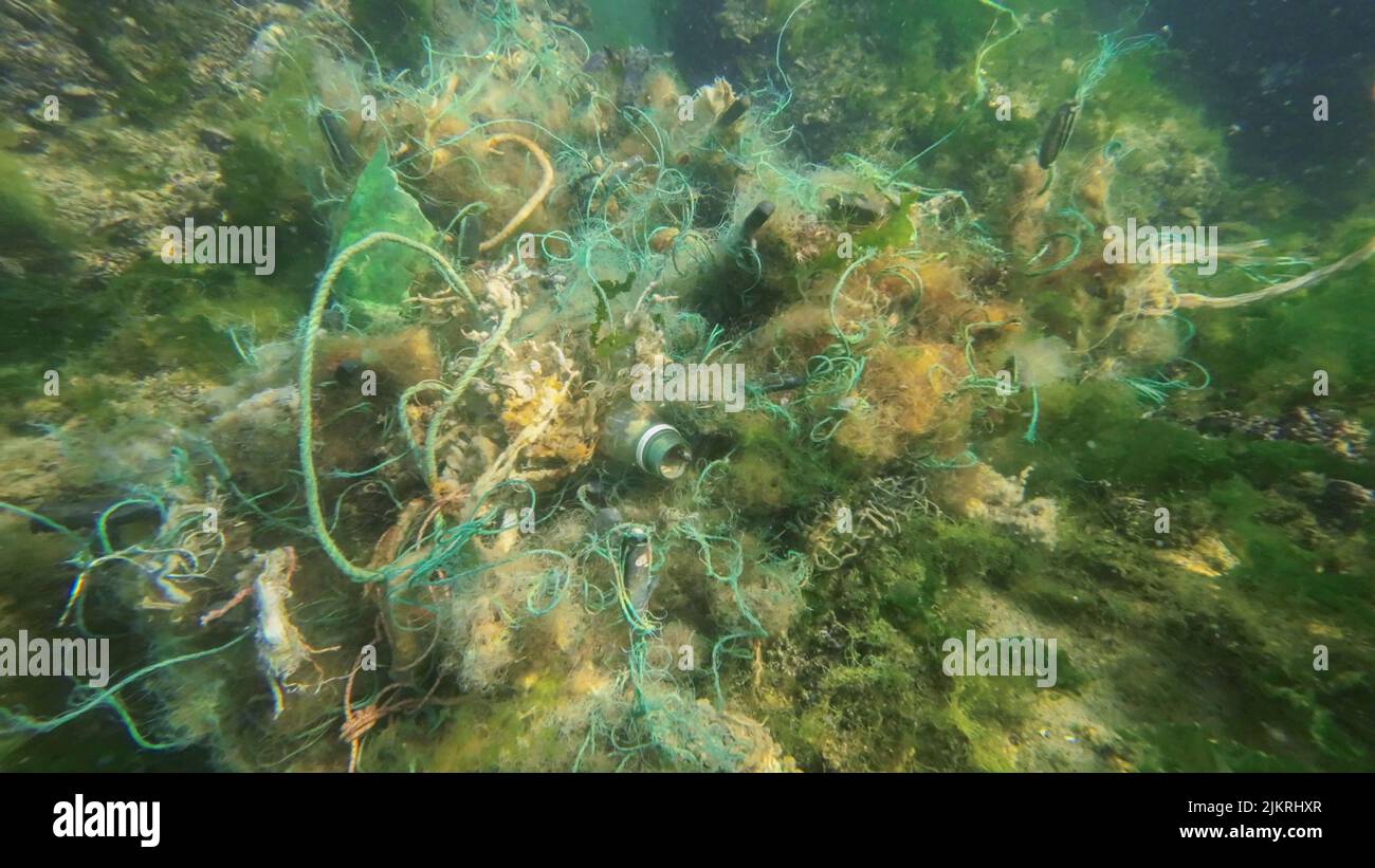 Lost fishing gear lies underwater on the seabed. Problem of ghost gear ...