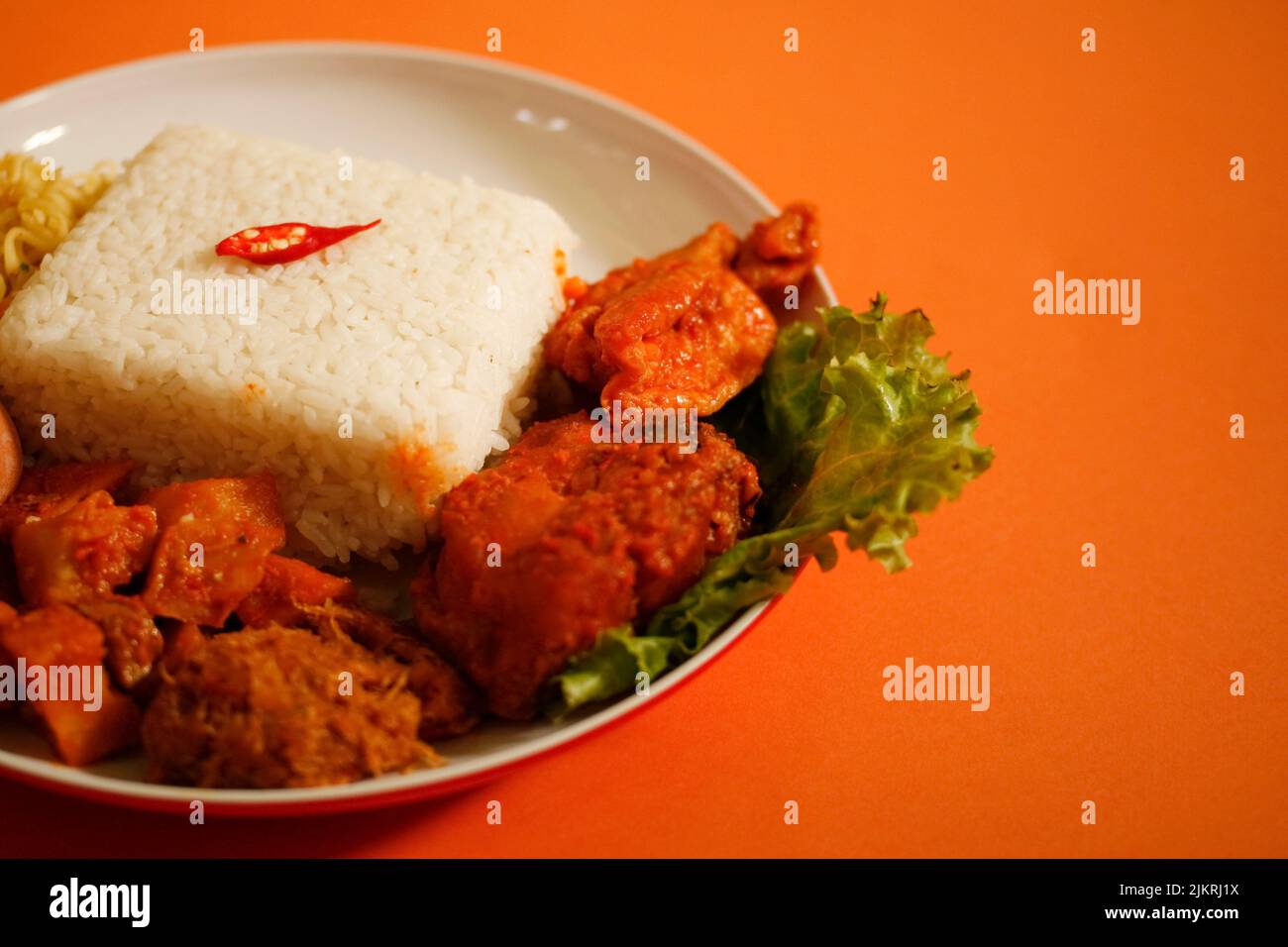 Rice Box or Indonesian lunch box with chicken meat, tofu, spicy potato ...