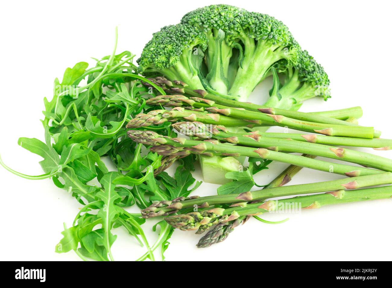 green farm vegetables, arugula, broccoli, asparagus on white background ...