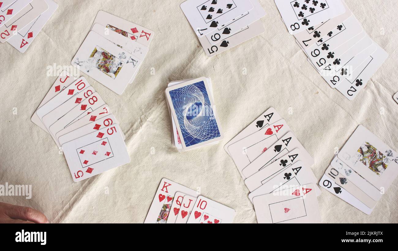 Scattered playing cards hi-res stock photography and images - Alamy