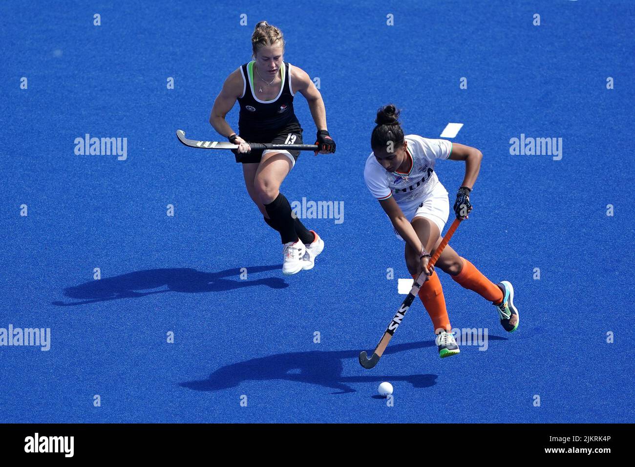 Canada's Hannah Haughn battles for the ball with India's Jyoti at the ...