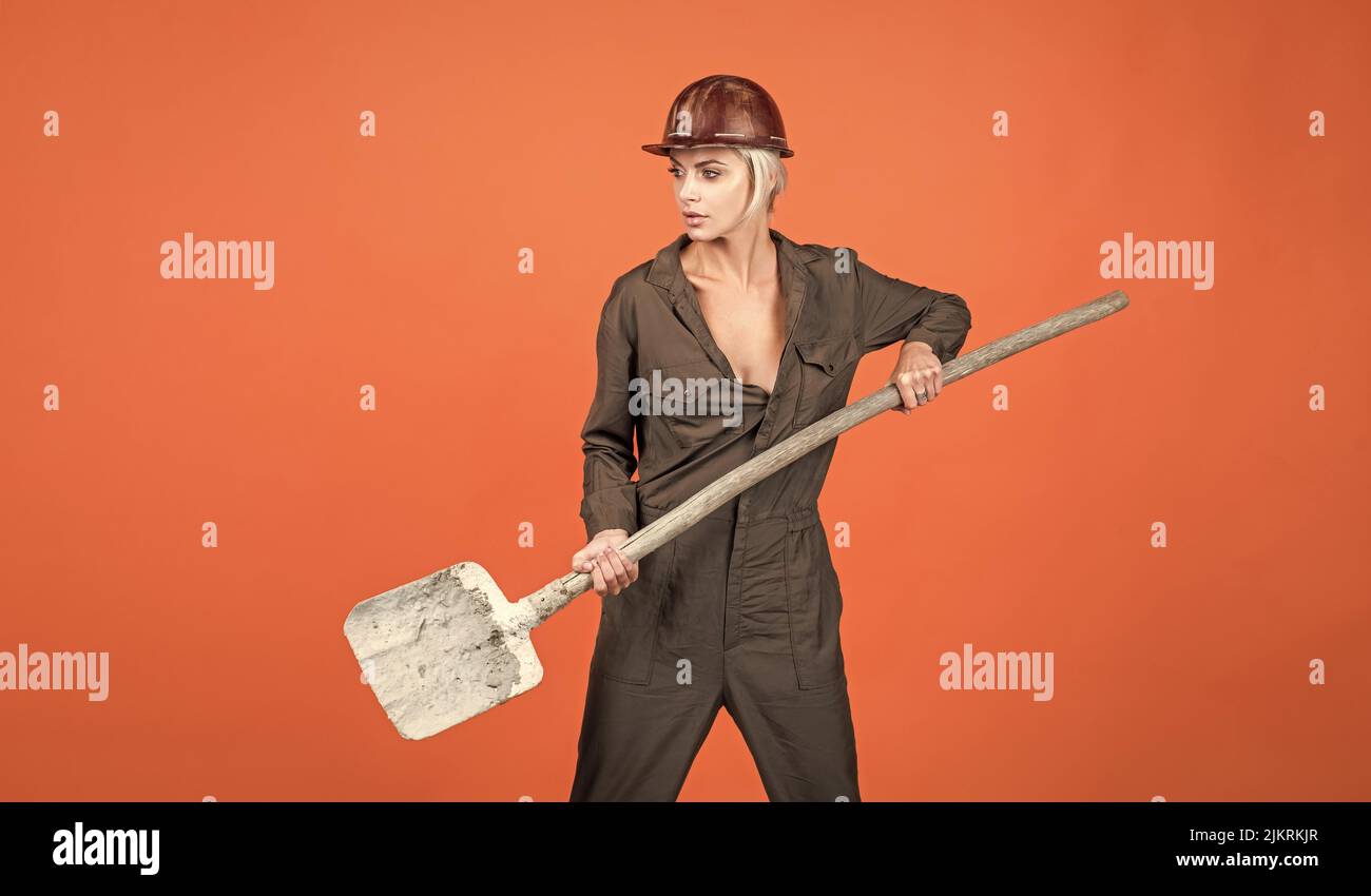 foreman girl wear safety hardhat. labor day. woman in boilersuit and ...