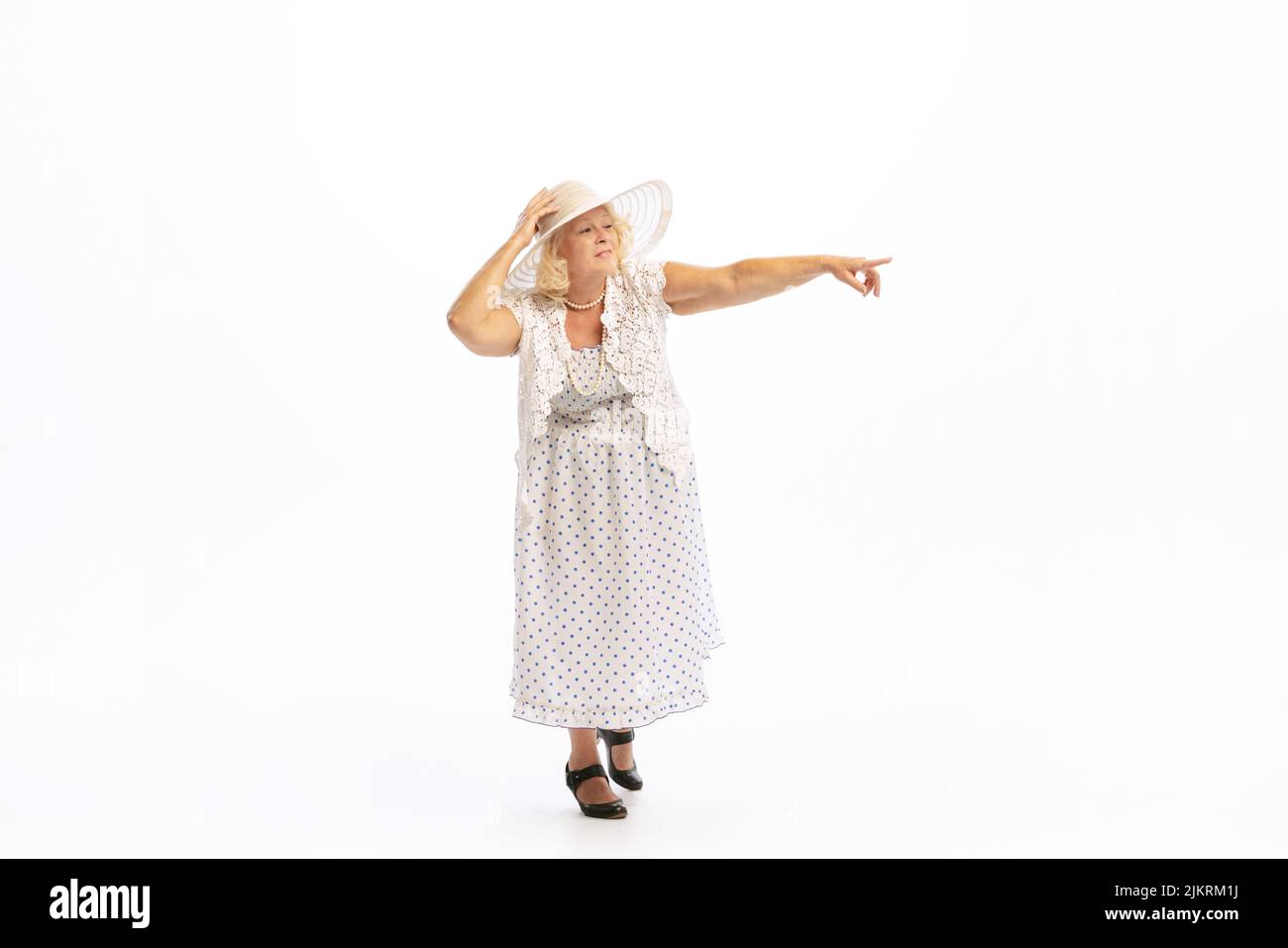 Portrait of beautiful senior woman in retro vintage style outfit posing ...