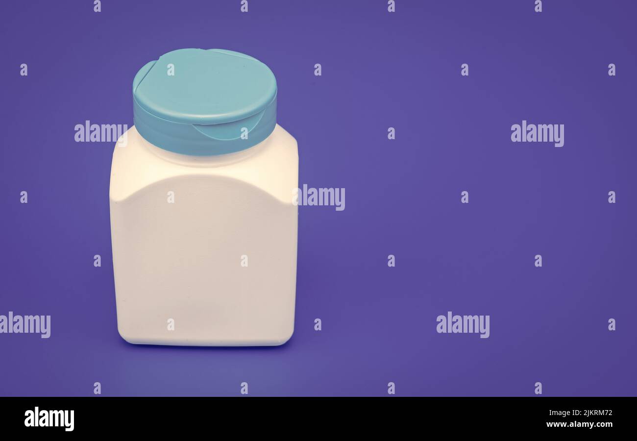 food supplement. presenting vitamin product. white unbranded pill jar ...