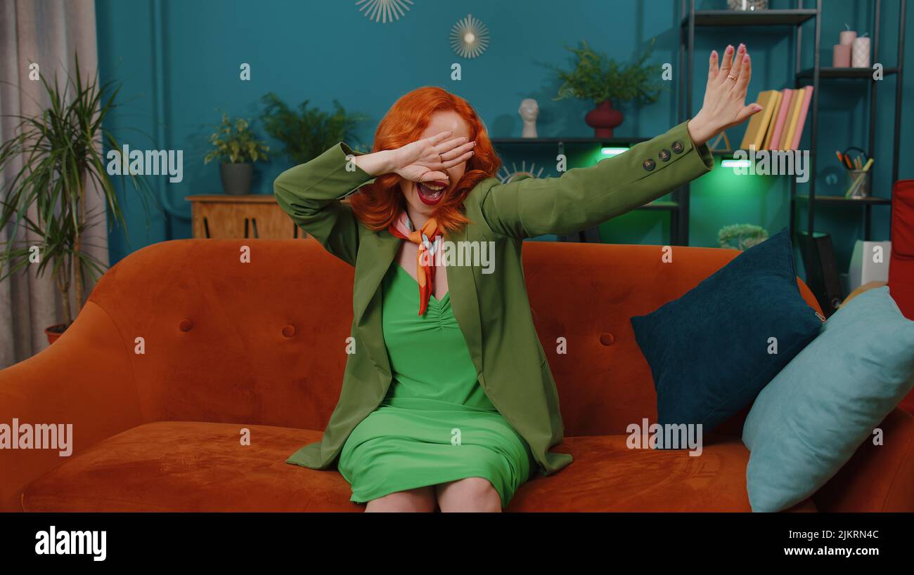 Trendy cheerful positive redhead young woman having fun dancing and ...