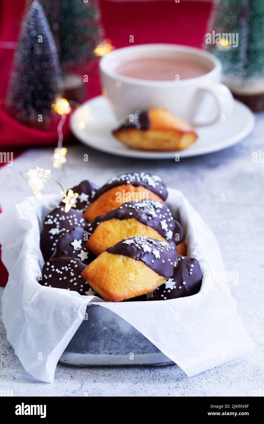Traditional French madeleine cookies served with coffee, Christmas ...