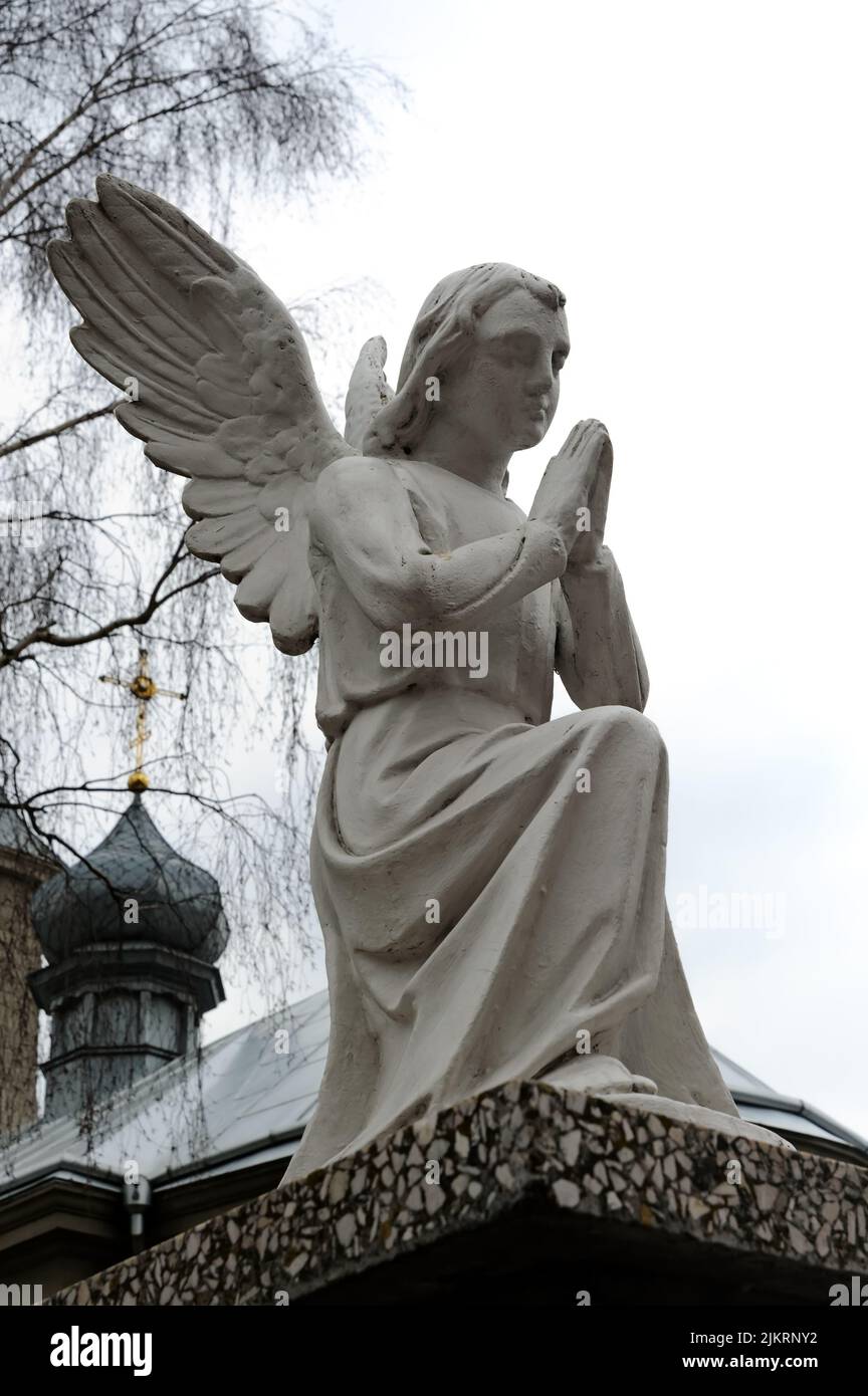 Traditional praying angel sculpture outdoors in Ternopil Ukraine Stock ...