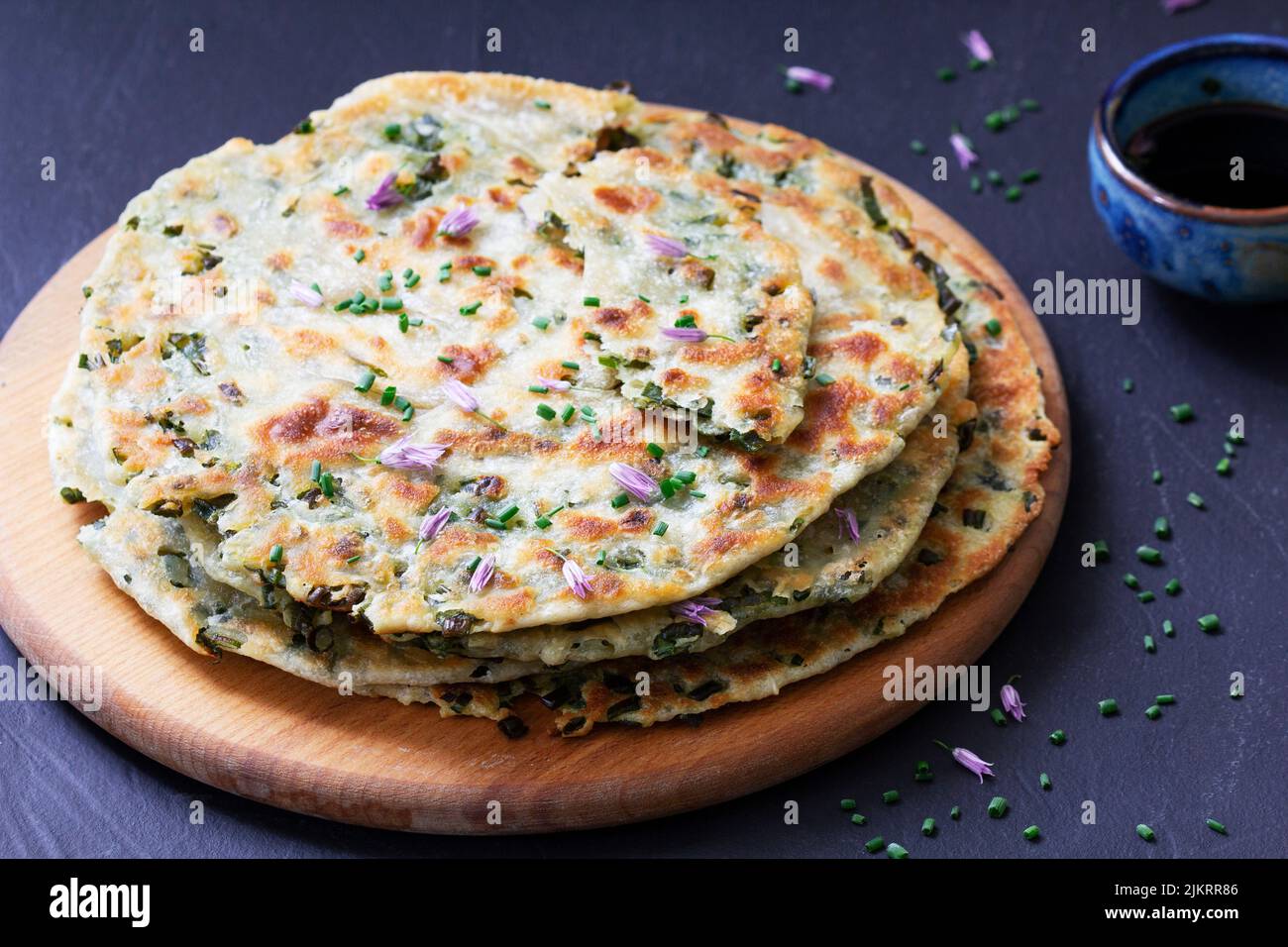 Homemade appetizing scallion pancakes served with soy sauce Stock Photo ...