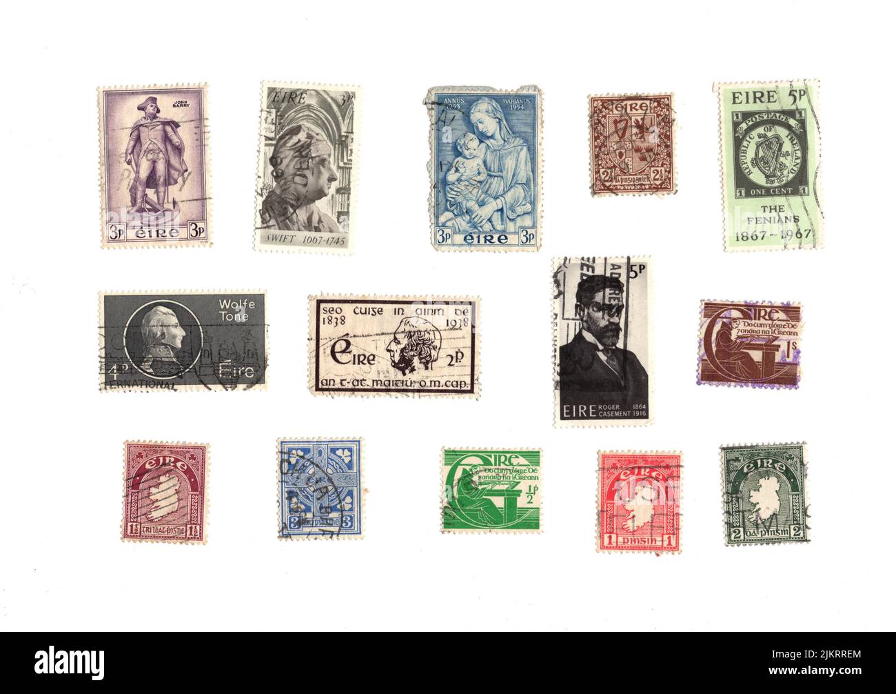 A selection of old postage stamps from Ireland on a white background ...