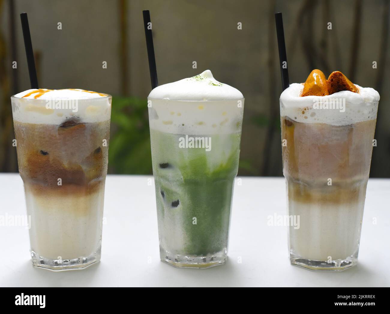 Coffee beverages with coffee beans on wooden table in a coffee shop ...