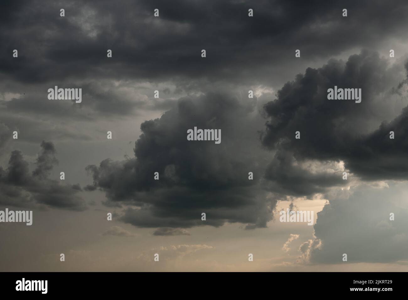 Overcast heavy sky with gray heavy clouds. Bad weather, dusk, typhoon ...