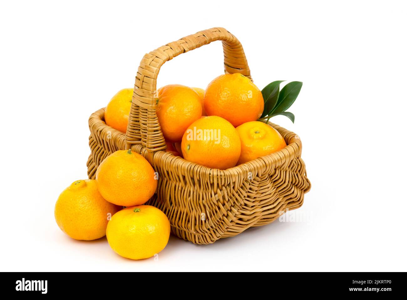 fresh tangerines in a basket on white background Stock Photo - Alamy