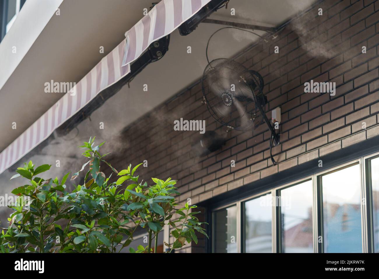 Air cooling system with water vapor and fans during heat and high ...