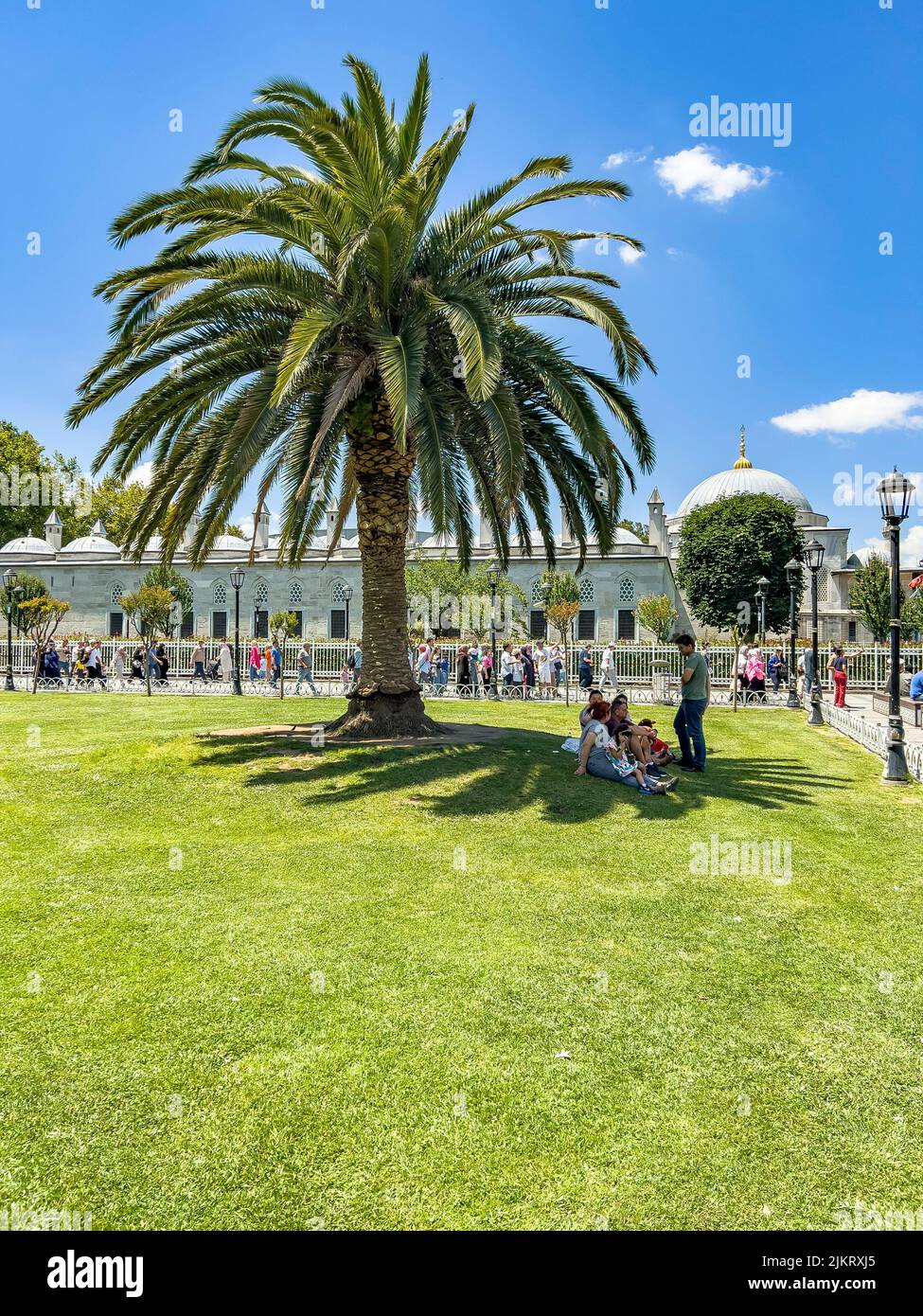 Istanbul - Turkey - July 14, 2022: Happy tourist family sitting and ...