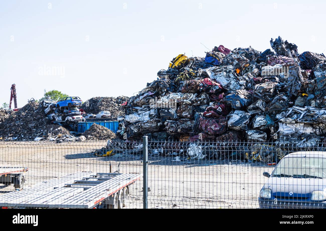 Pile of crushed and deformed cars in the car scrapyard. Oswiecim ...