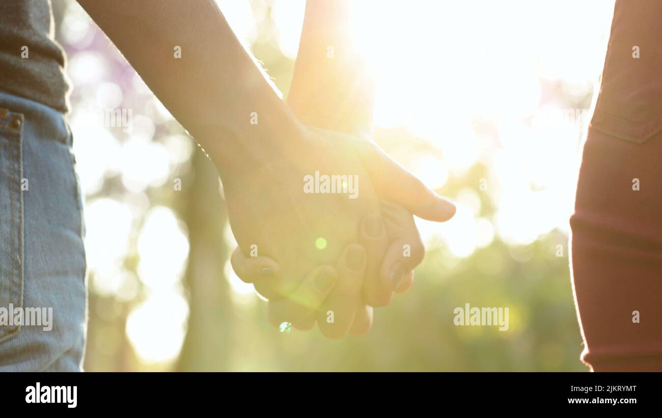 Joining hands together uniting the chain from hands held together in ...