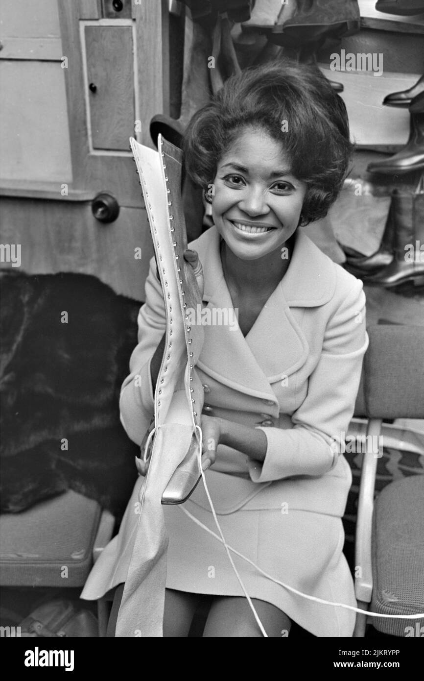 NANCY WILSON (1937-2018) American singer shopping for boots on Oxford ...