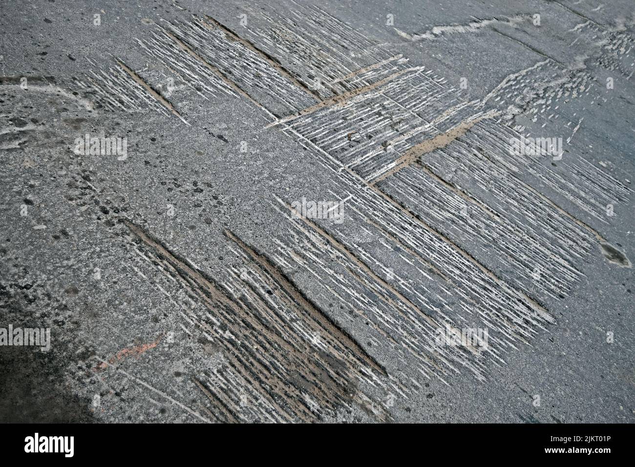 abstract damaged asphalt road, corrupted street material diversity ...