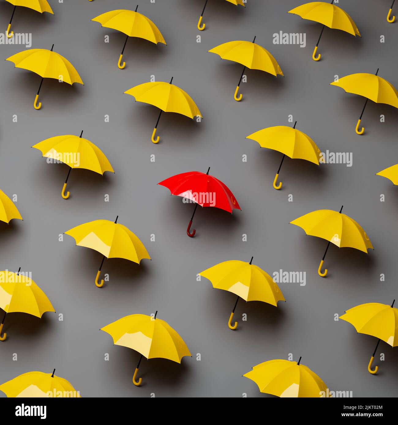 Special red umbrella in pattern of yellow umbrellas on gray background ...