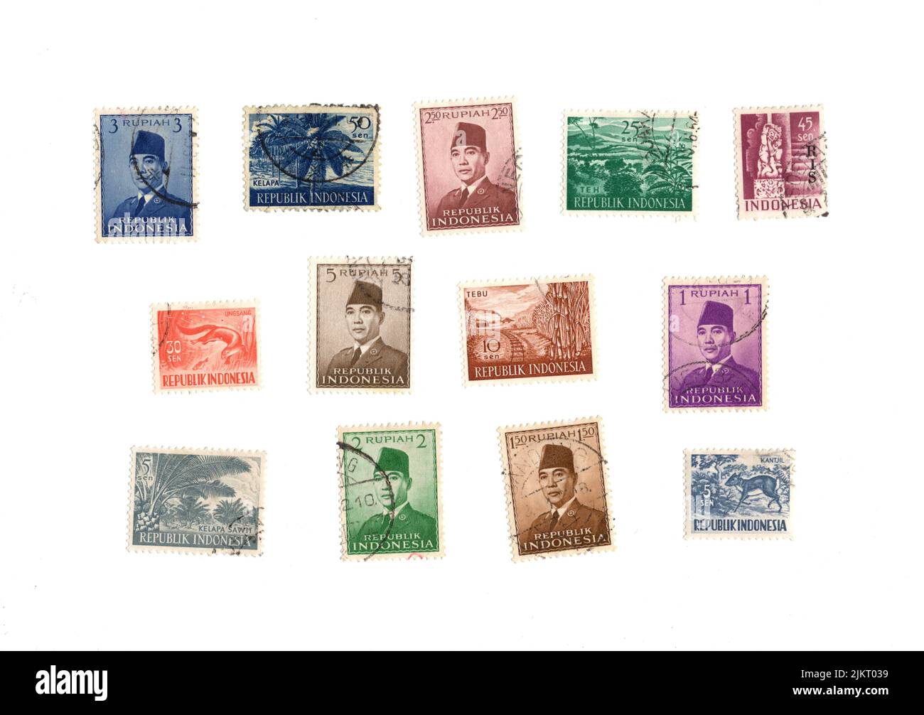 A selection of old postage stamps from Indonesia on a white background ...