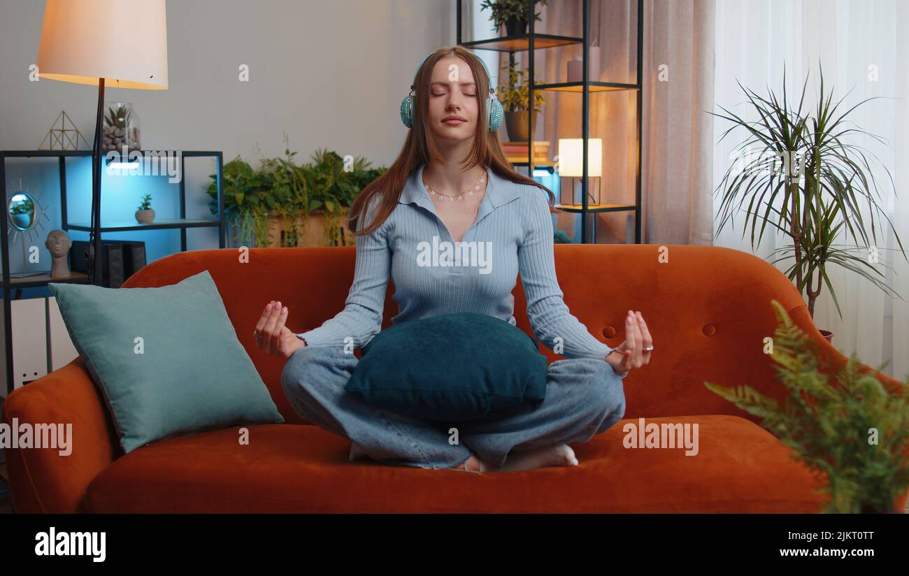 Keep calm down, relax, inner balance. Young woman breathes deeply with ...