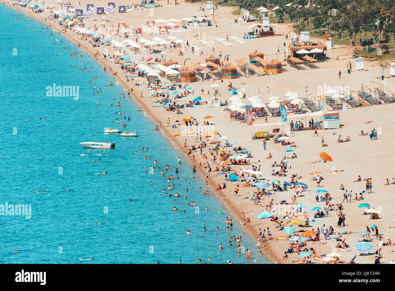 04 June 2022, Antalya, Turkey: Crowded city beach with hundreds of ...