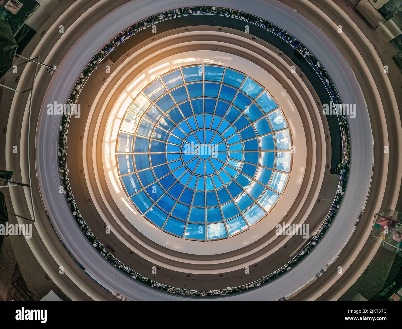 Large round window on ceiling of shopping complex Stock Photo - Alamy
