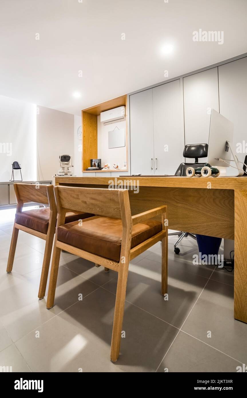 ophthalmologist's office wooden consulting room with computer on the ...