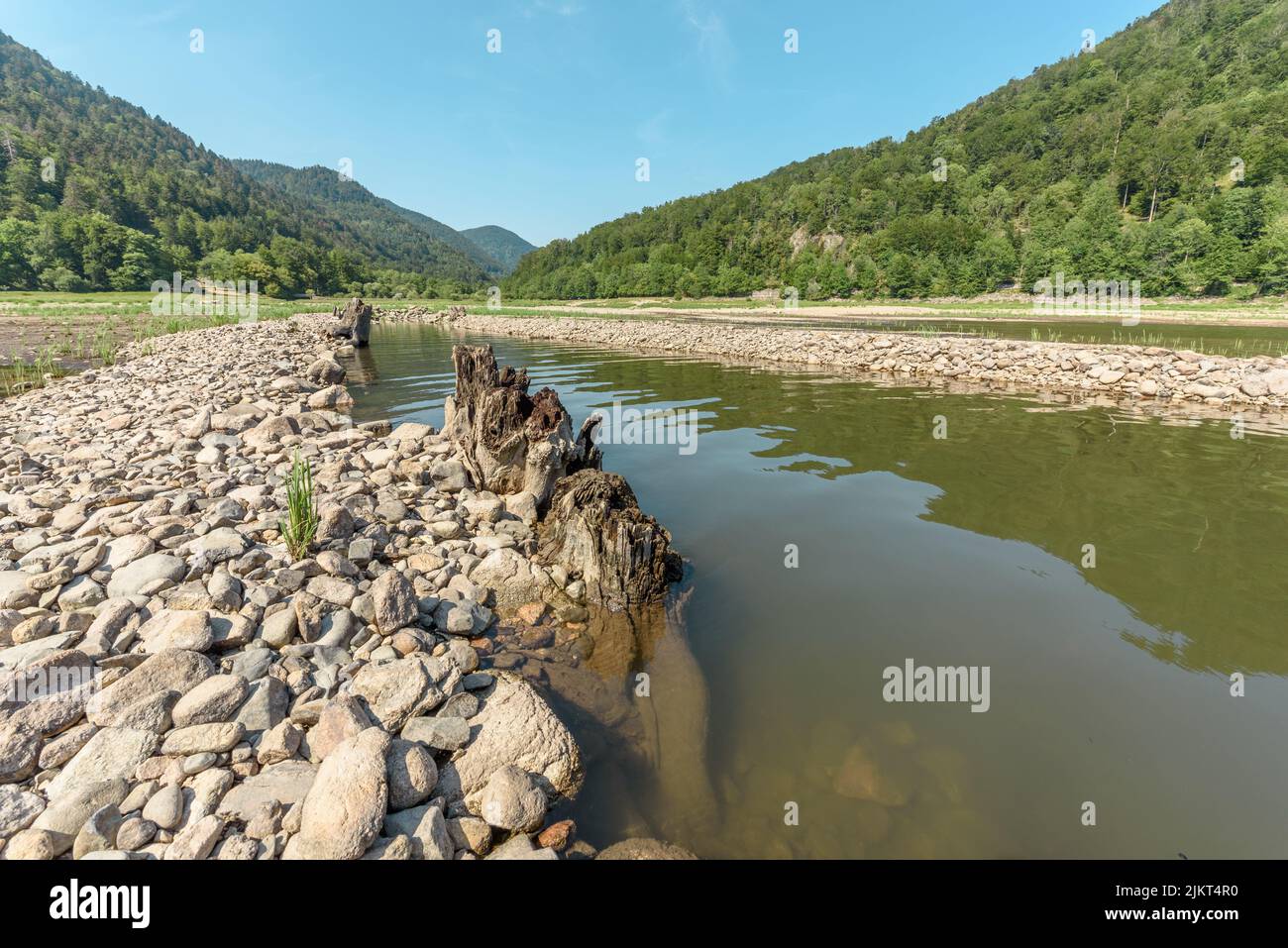 Water level drops in mountain lake in summer. Wildenstein, Vosges ...