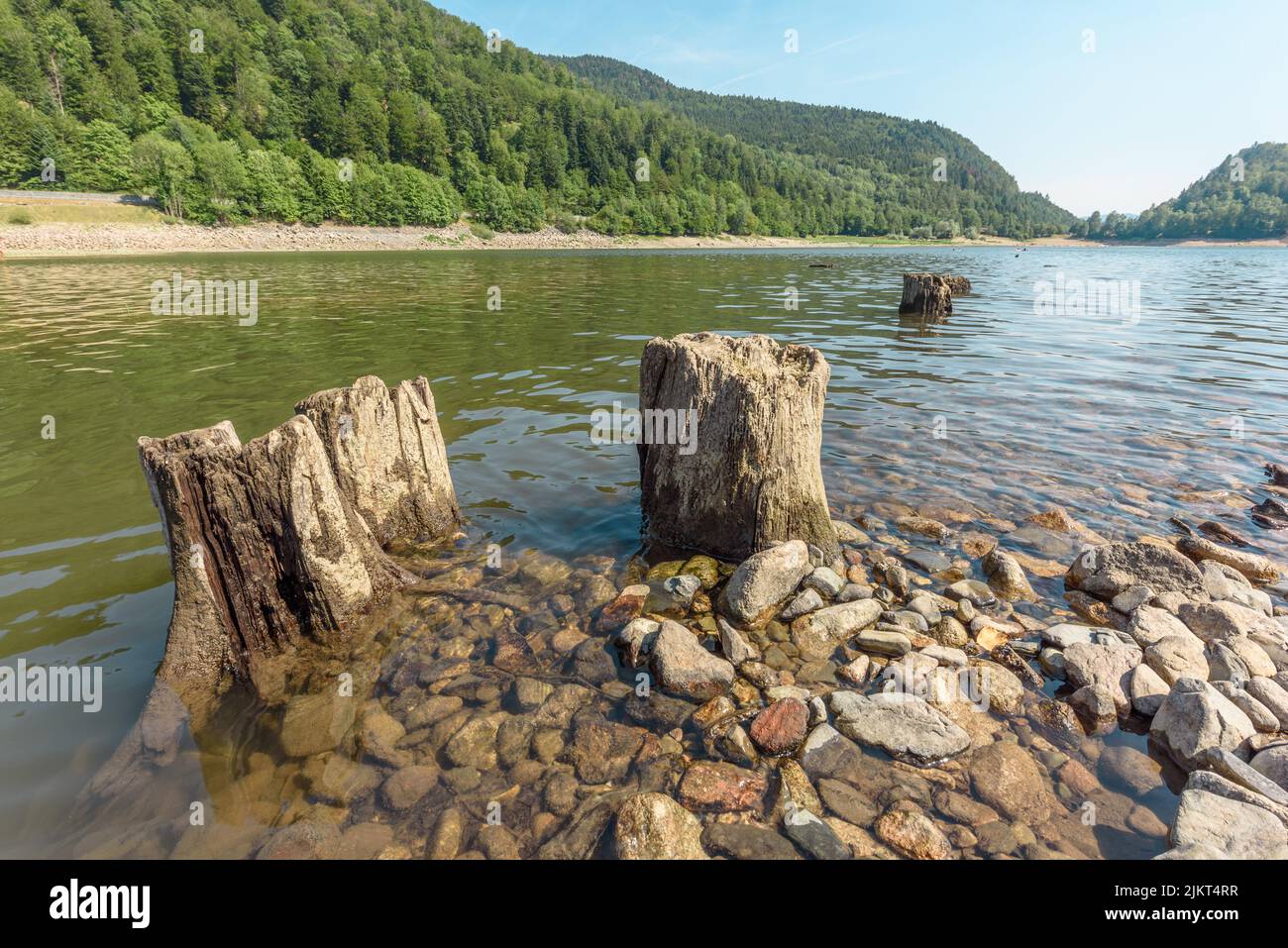 Water level drops in mountain lake in summer. Wildenstein, Vosges ...
