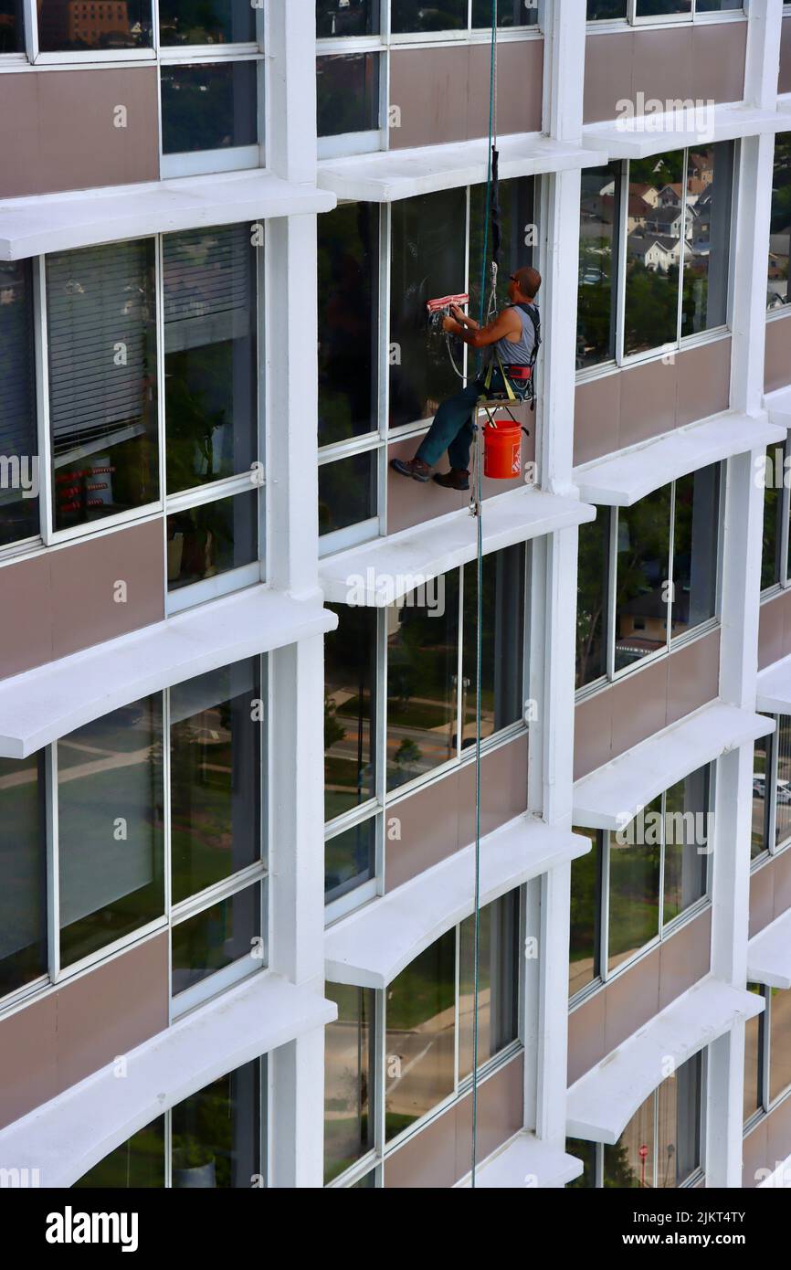 Window cleaner hanging on ropes on 30-story building in Northeast Ohio ...