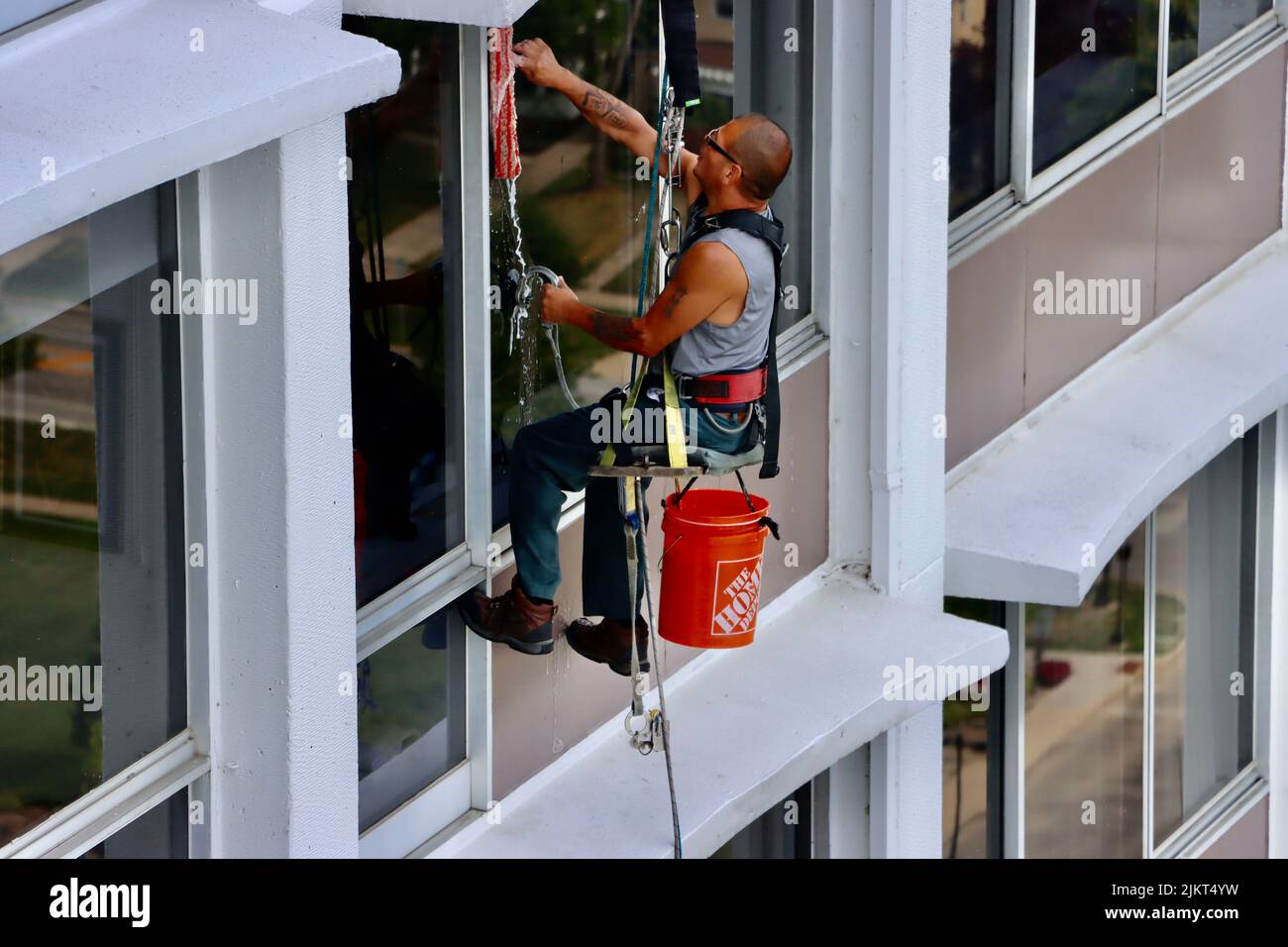 Window cleaner hanging on ropes on 30-story building in Northeast Ohio ...