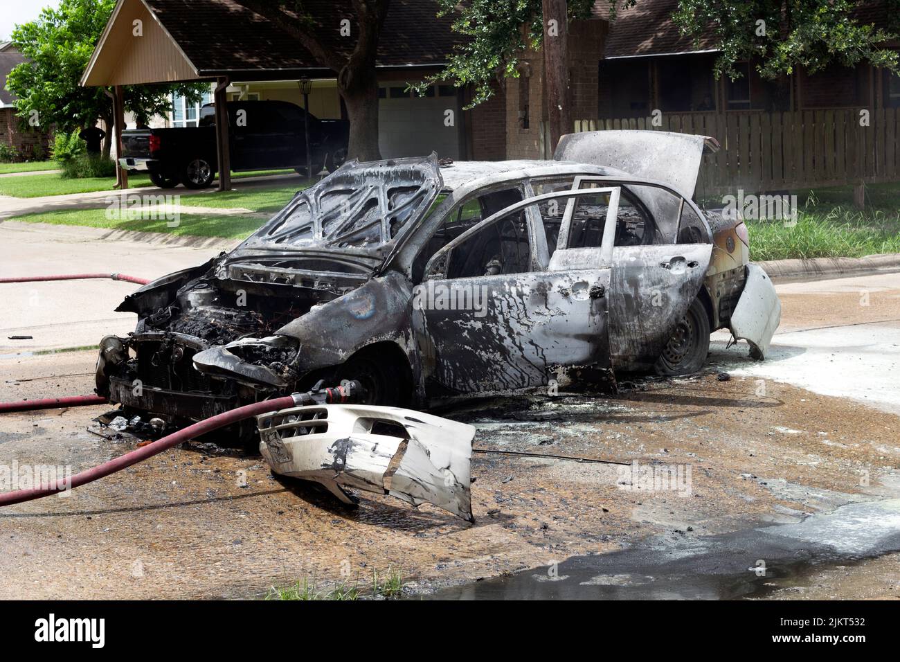 destroyed burnt out car after traffic accident Stock Photo - Alamy