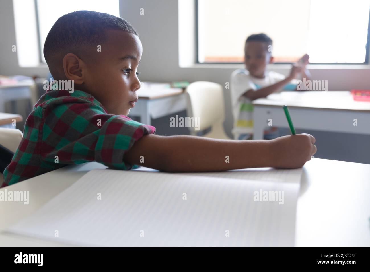 Writing at desk classroom hi-res stock photography and images - Alamy