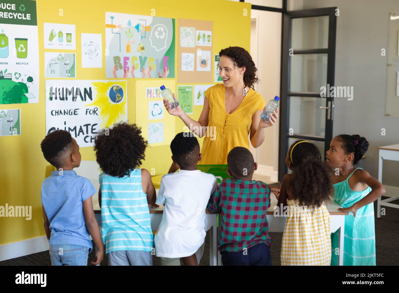 Female young caucasian teacher teaching environmental conservation to ...