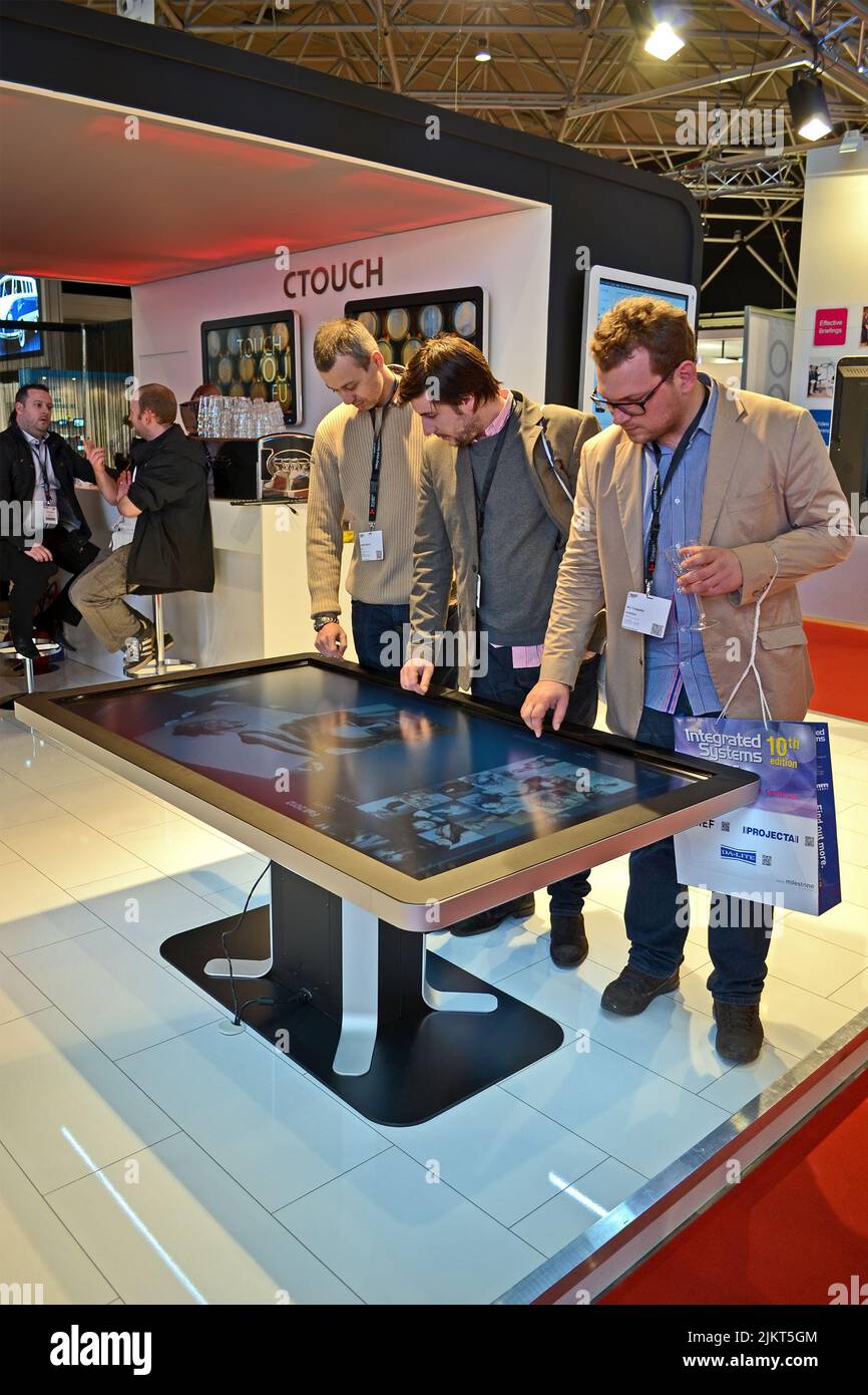 visitors test display wall at the Integrated Systems Europe (ISE ...