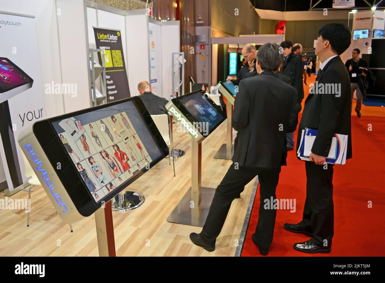 visitors test display wall at the Integrated Systems Europe (ISE ...
