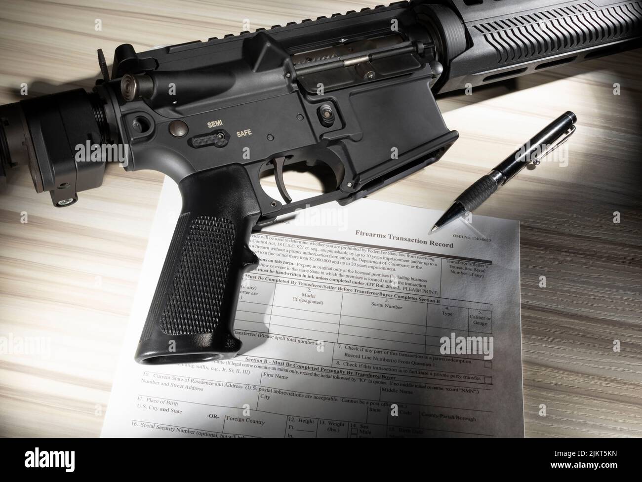 Assault rifle and public domain background check form for its purchase ...